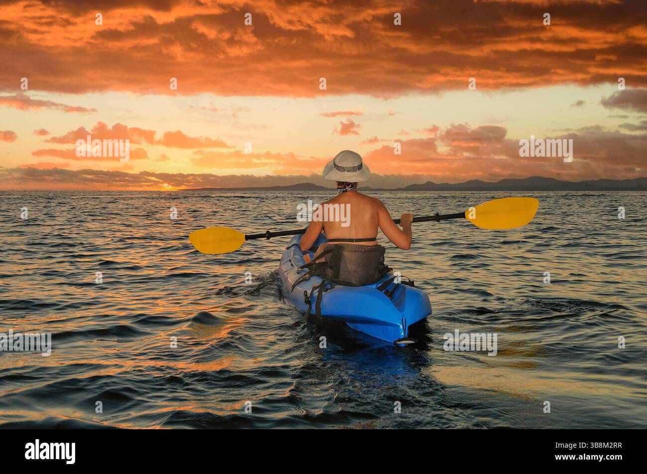 Mexico, Baja California, Ventana Bay, El Sargento, sunrise with kayak ...