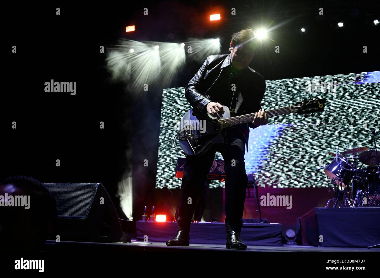 Guitarist, Charlie Burchill of british band Simple Minds, performs on ...