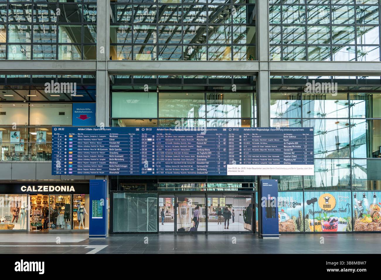 Large display with train timetables at Berlin Hauptbahnhof. Berlin's ...