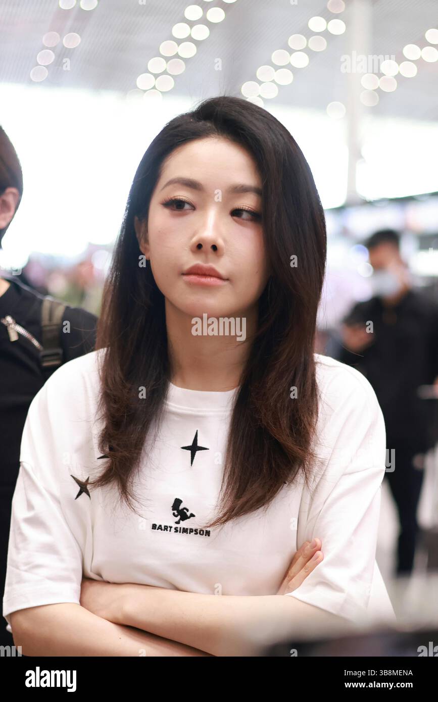 Chinese singer and actress Yu Yan appears at the airport in Beijing ...