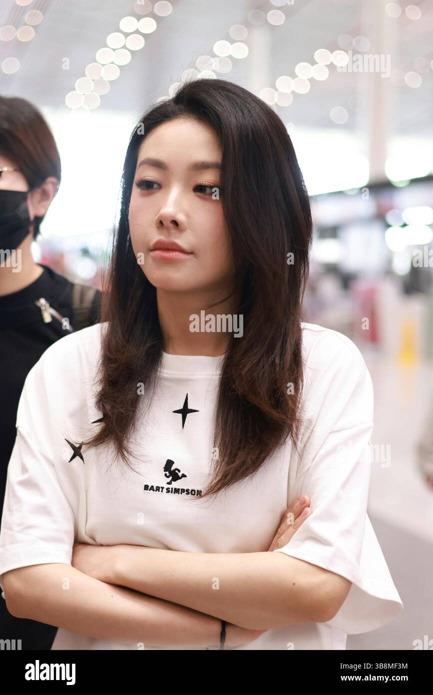 Chinese singer and actress Yu Yan appears at the airport in Beijing ...