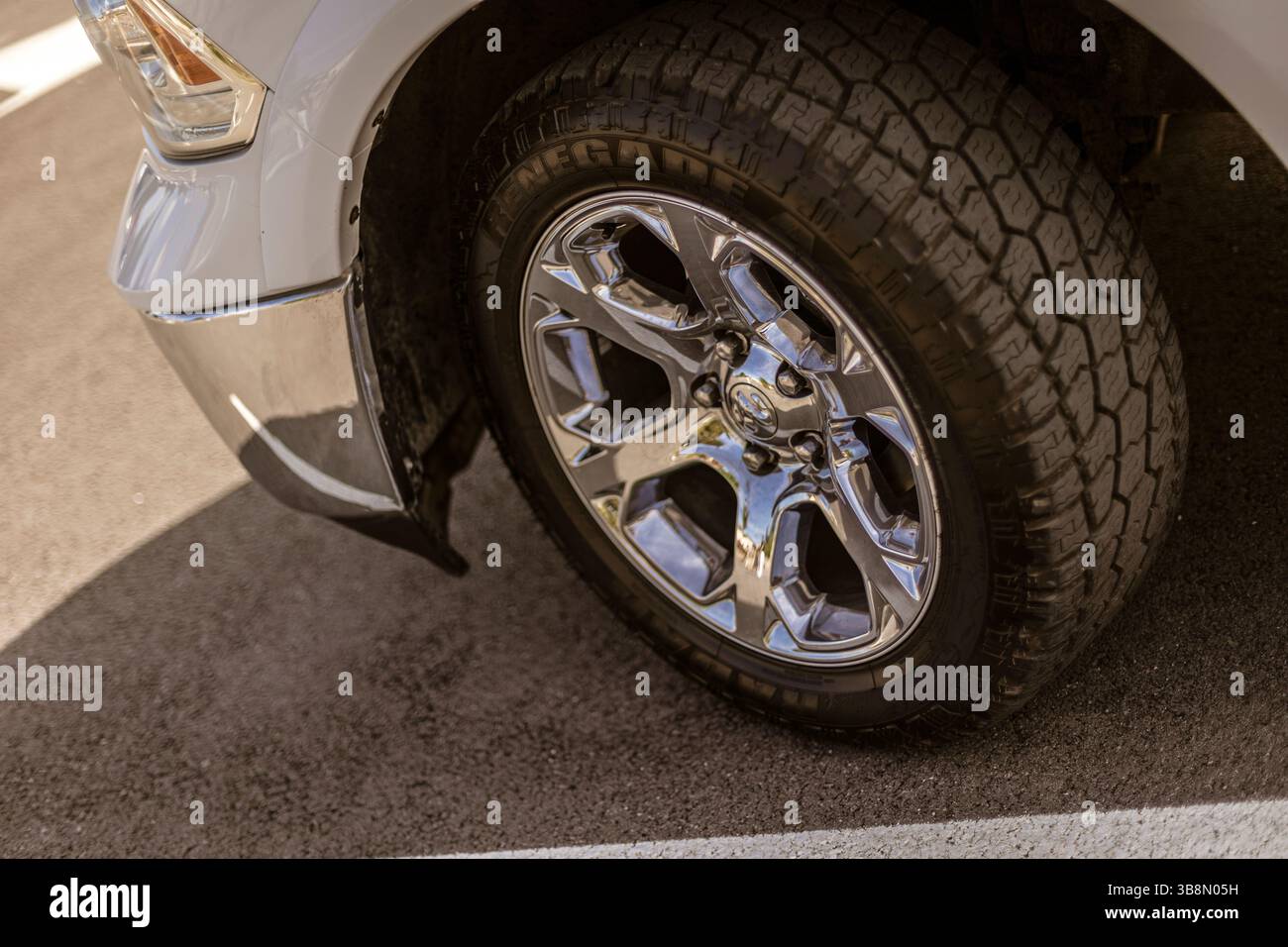 Rome, italy 4 may 2025: chrome wheel and tire detail of a parked white ...