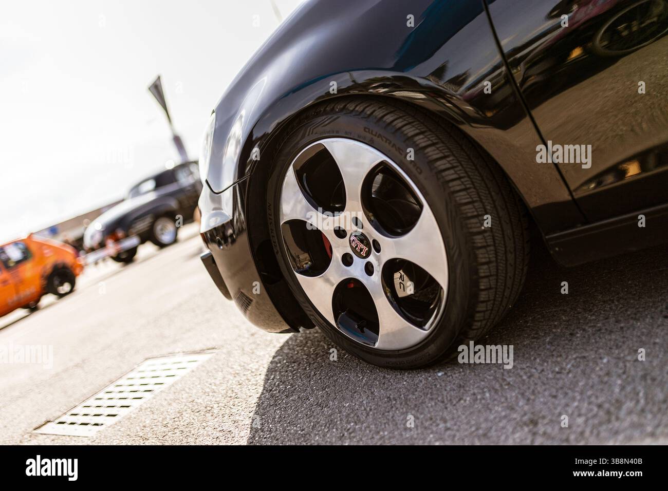 Rome, italy 4 may 2025: shiny black volkswagen golf gti showcasing its ...