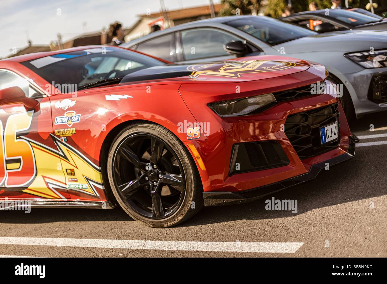 Rome, italy 4 may 2025: customized red chevrolet camaro with lightning ...