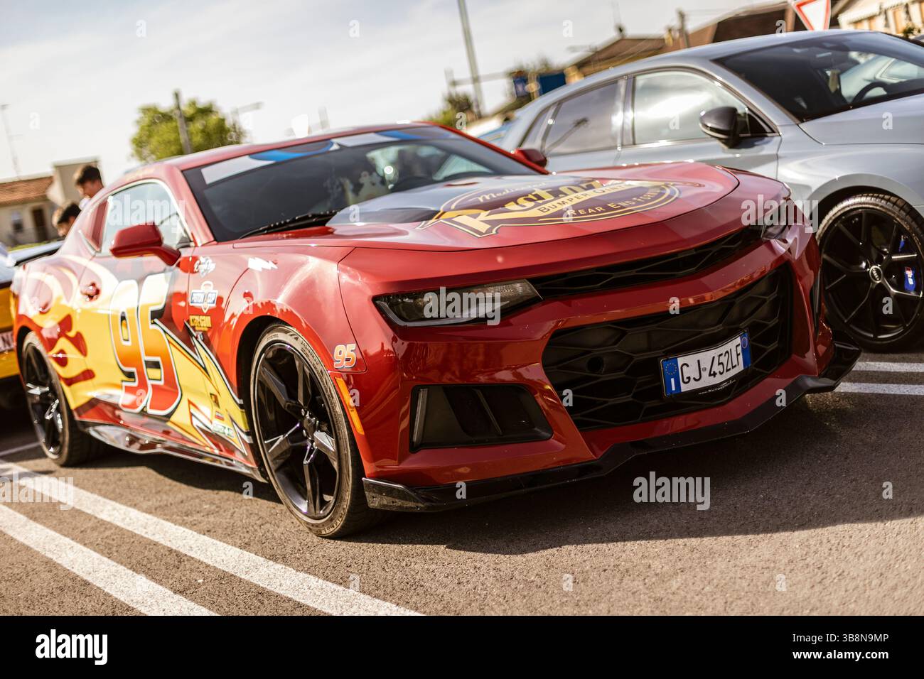 Rome, italy 4 may 2025: customized red chevrolet camaro with a ...
