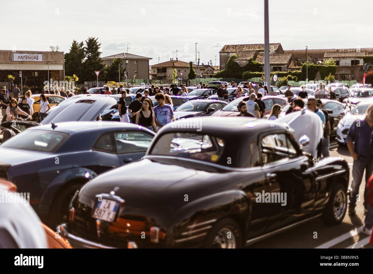 Rome, italy 4 may 2025: people exploring a diverse collection of cars ...