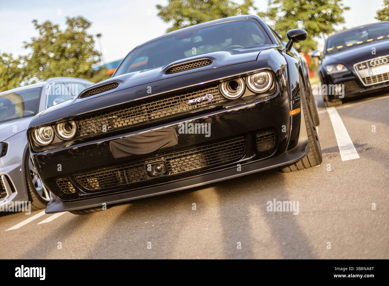 Rome, italy 4 may 2025: close-up view of a black dodge challenger srt ...