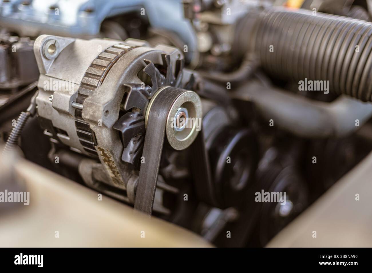 Rome, italy 4 may 2025: close-up of a car alternator and drive belt ...