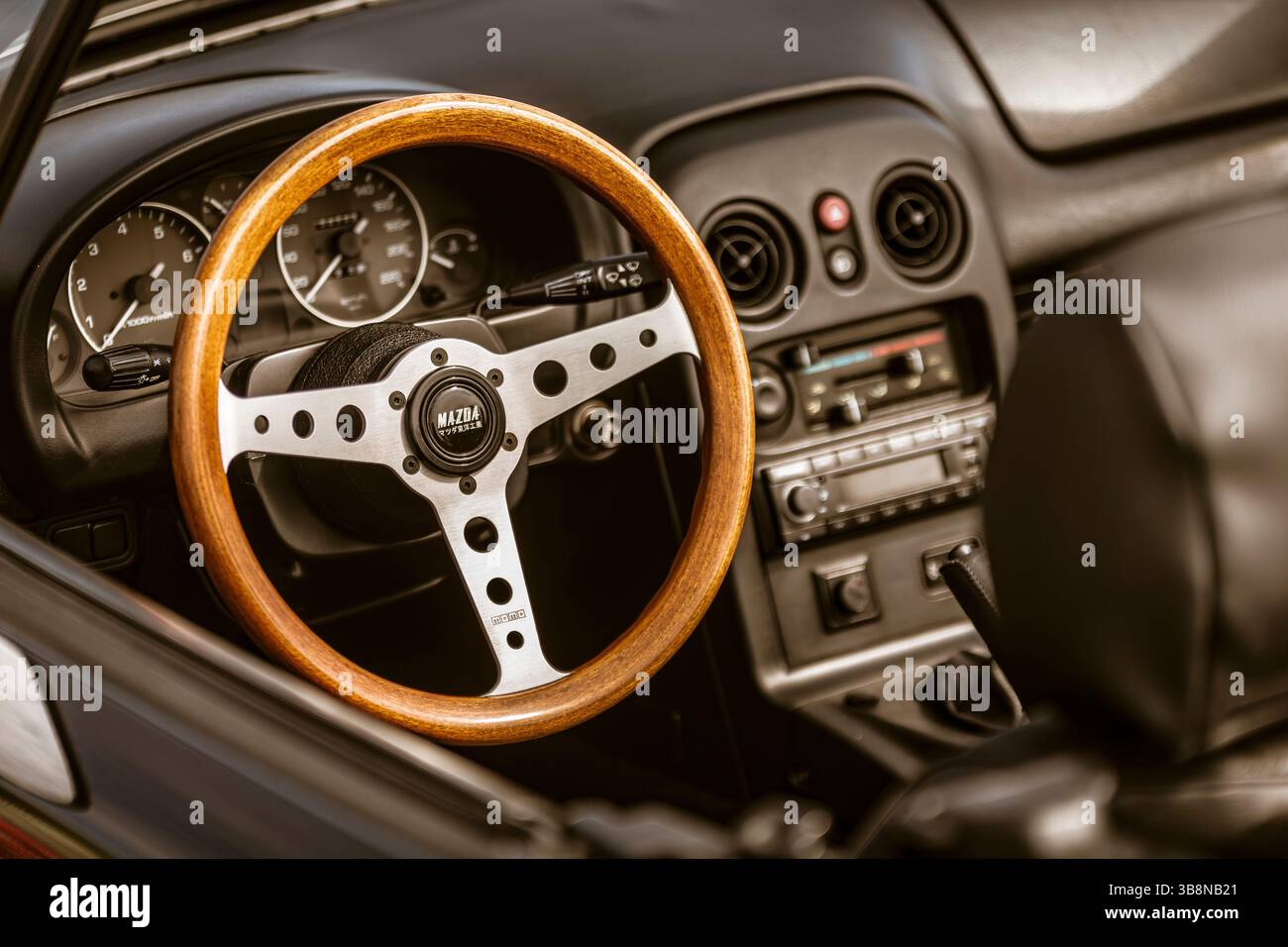 Rome, italy 4 may 2025: close-up of wooden steering wheel and dashboard ...