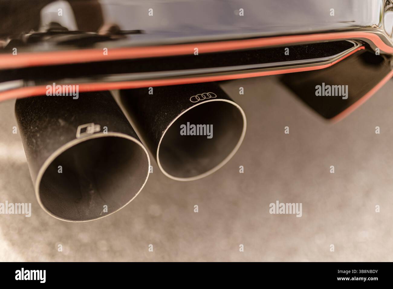 Rome, italy 4 may 2025: dual exhaust pipes on a modern sports car ...