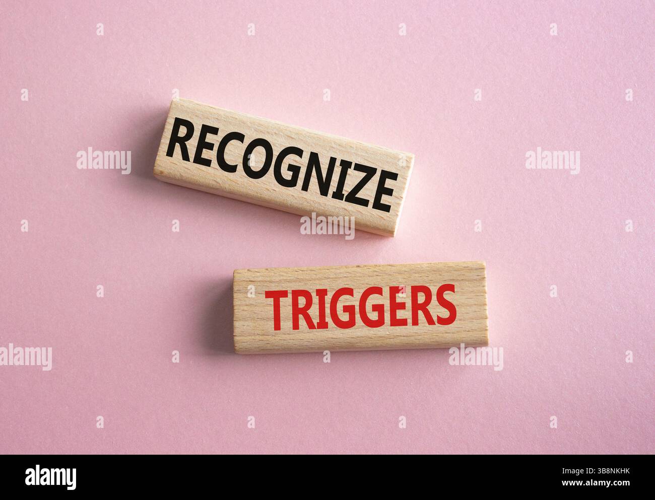 Recognize triggers symbol. Concept words Recognize triggers on wooden ...