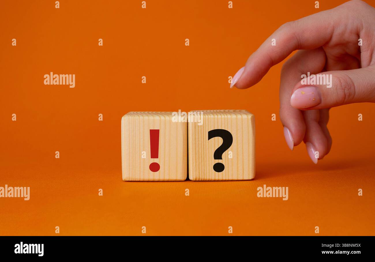 Question mark and exclamation mark symbol. Businessman hand is making a ...