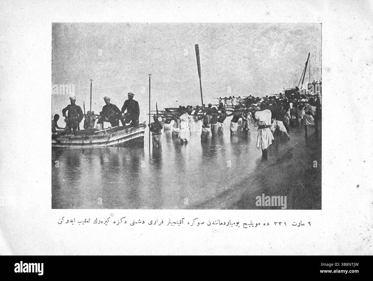 Soldiers in the water taking aim with rifles, at Wejh, a port on the ...