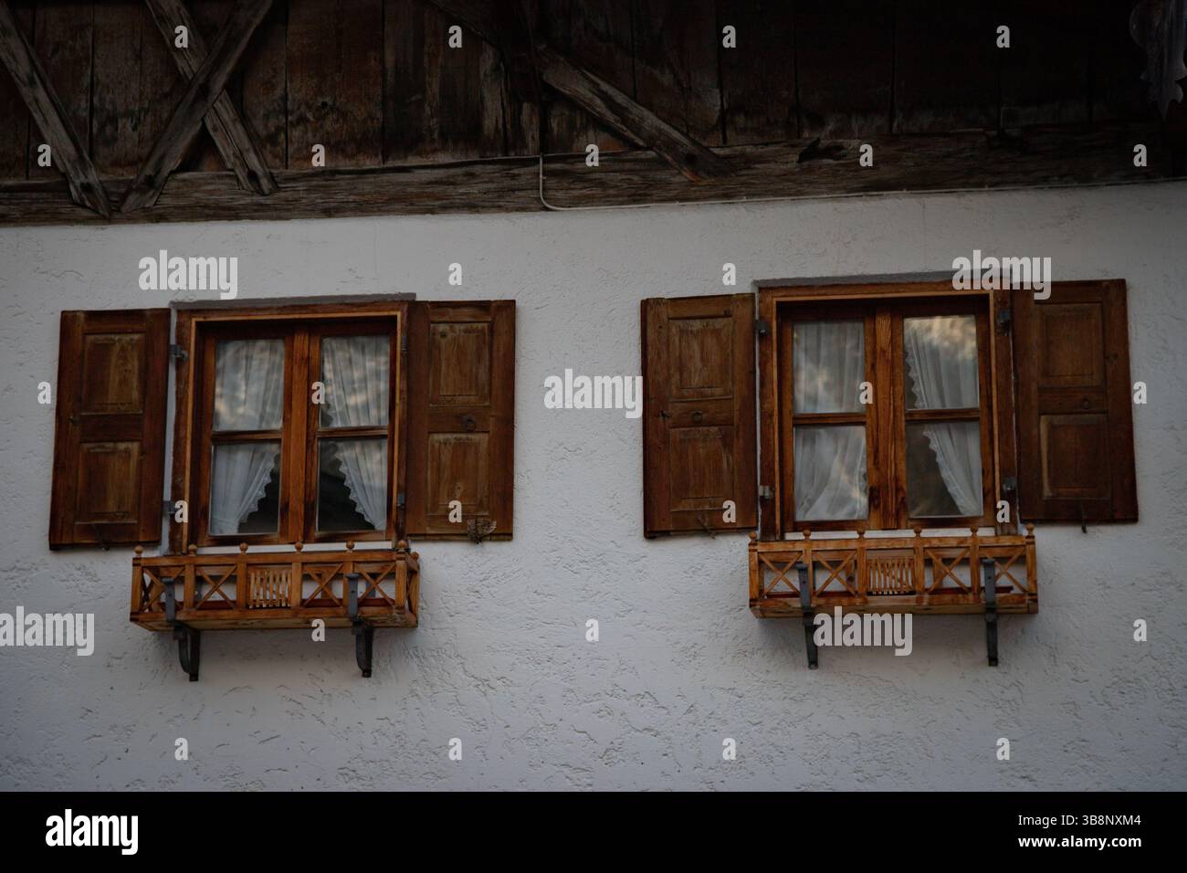Authentic wooden shuttered windows in an alpine village Stock Photo - Alamy