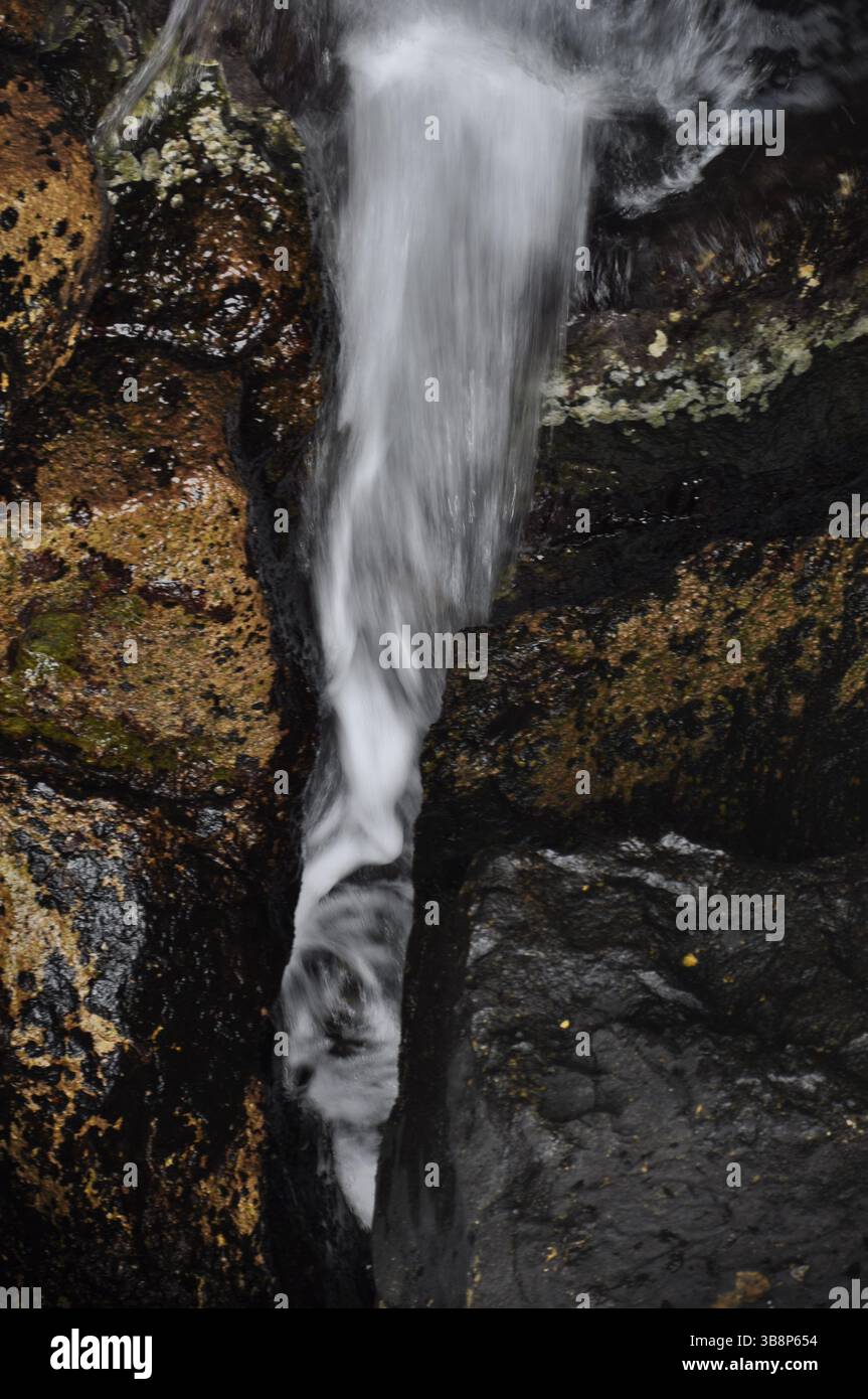 Waterfall between mountain rocks hi-res stock photography and images ...