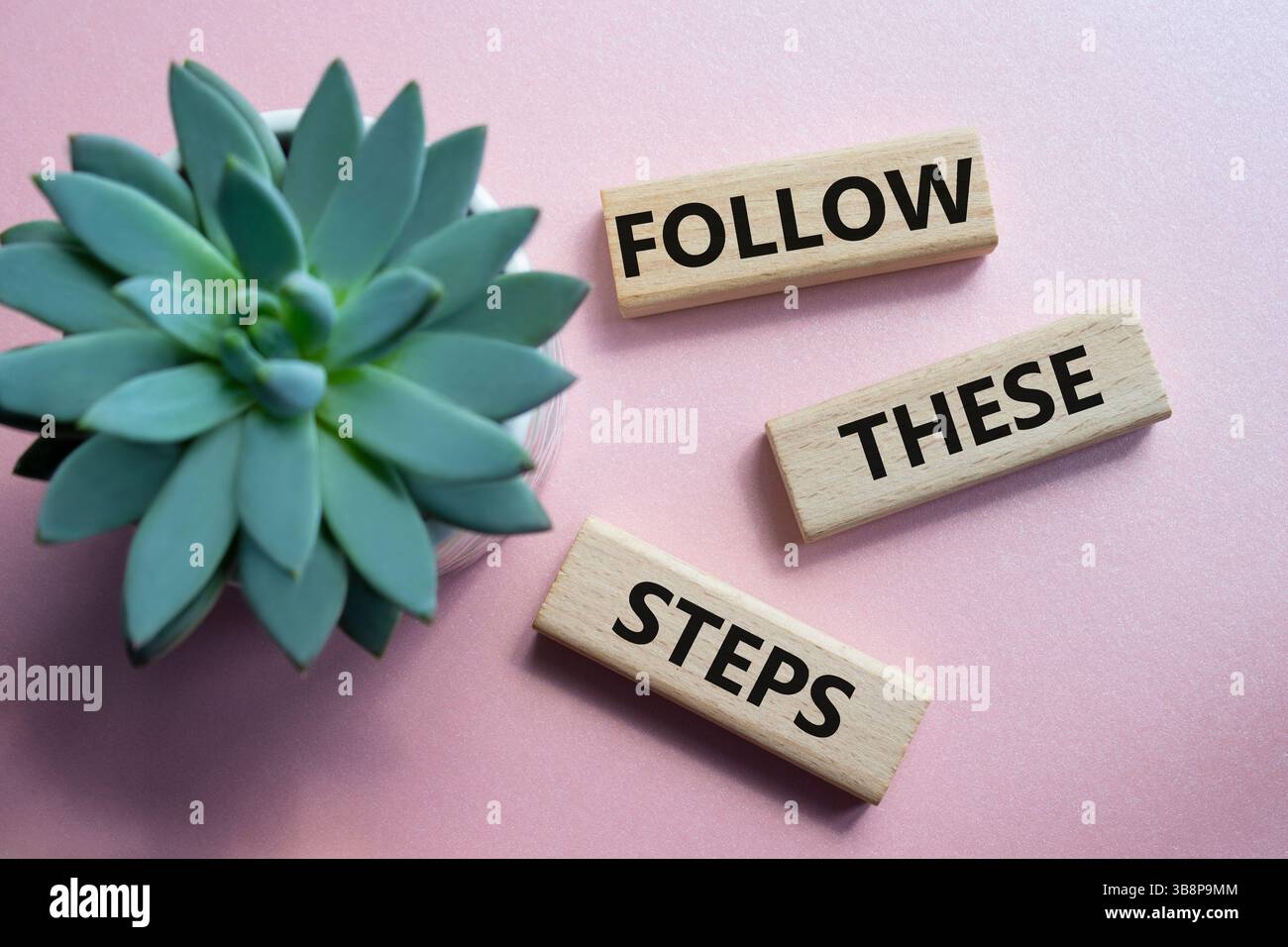 Follow these steps symbol. Wooden blocks with words Follow these steps ...