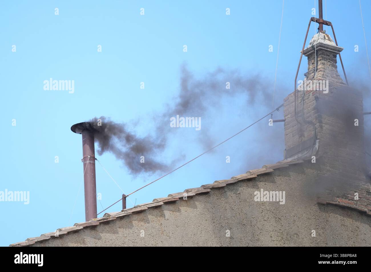 Black smoke billows from the chimney of the Sistine Chapel during the ...