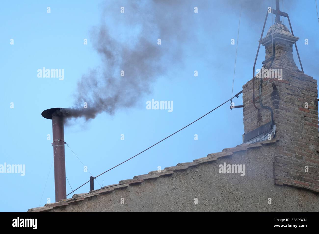 Black smoke billows from the chimney of the Sistine Chapel during the ...
