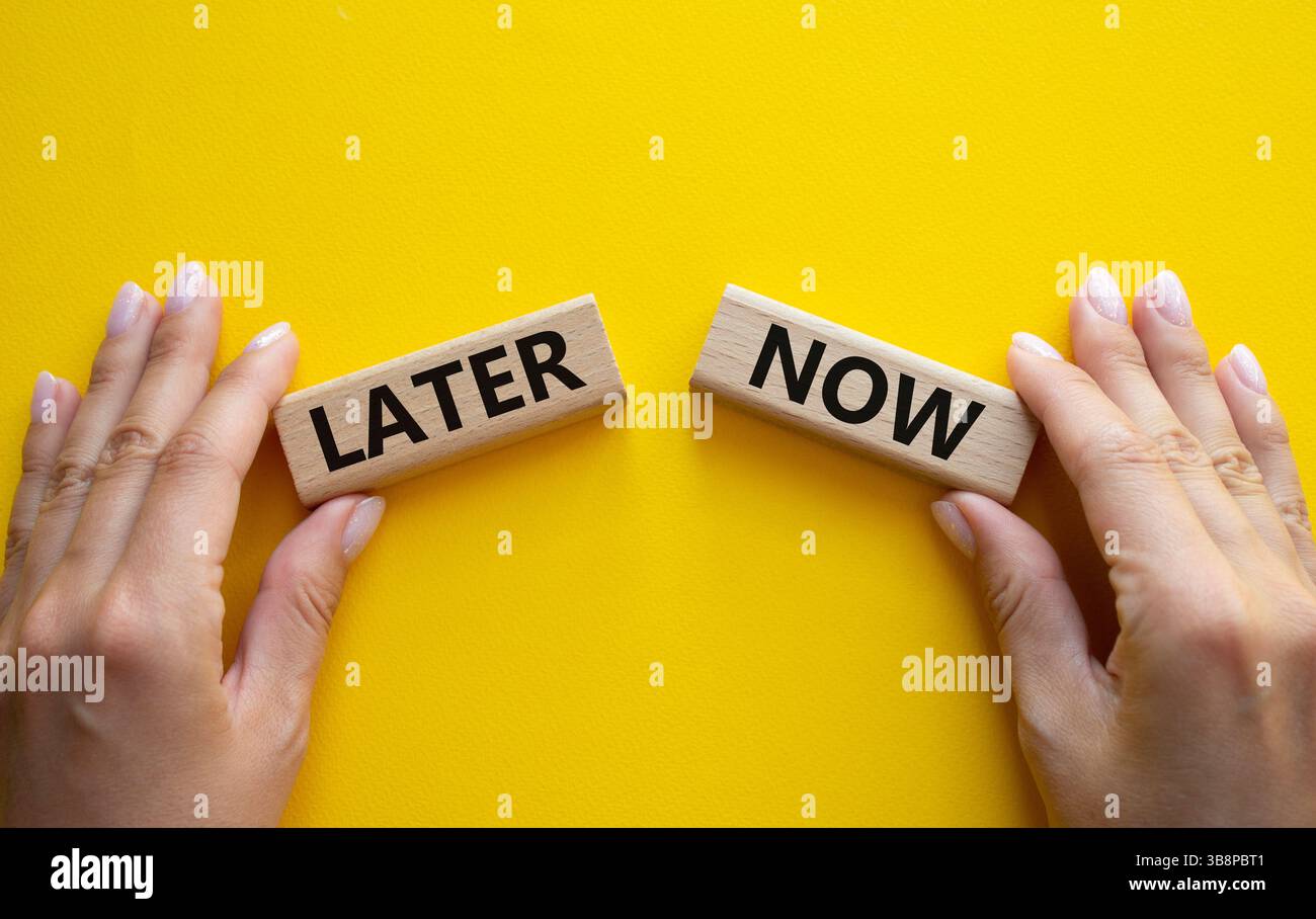 Now vs Later symbol. Concept word Now vs Later on wooden blocks ...