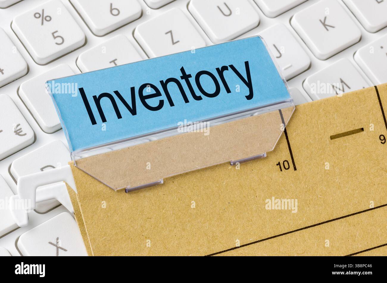 A brown file folder labeled with Inventory Stock Photo - Alamy