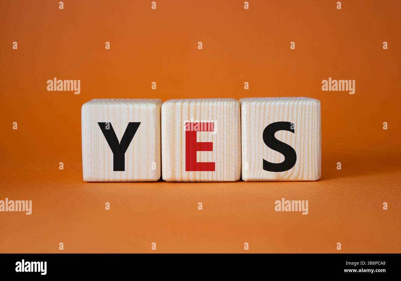 Yes symbol. Wooden blocks with word yes. Beautiful orange background ...