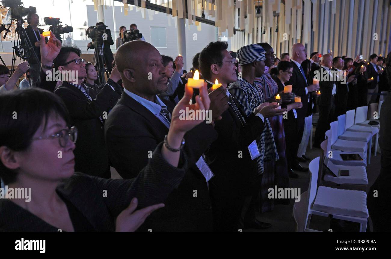 People attend a memorial Ceremony for Rwanda genocide at Yumeshima, a ...