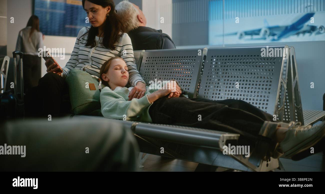 Mother and Daughter in Crowded International Airport Terminal: Tired Teen Girl Sleeping on Seats ...