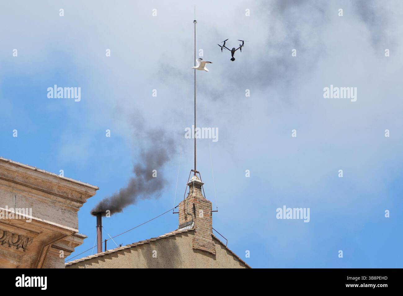A drone and a seagull fly by as black smoke billows from the chimney of ...