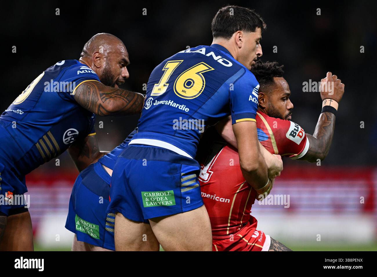 Hamiso Tabuai-Fidow of the Dolphins is tackled by Jordan Samrani of the ...