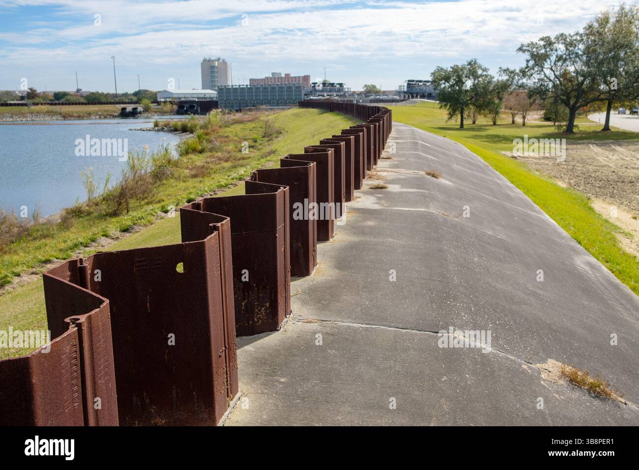 A levee with steel sheet piling protects the city from flooding Stock ...