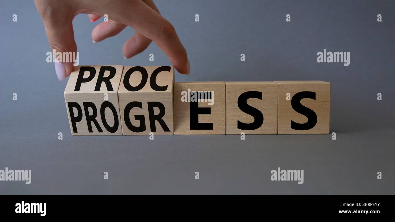 Process and Progress symbol. Hand turns wooden cubes and changes word ...