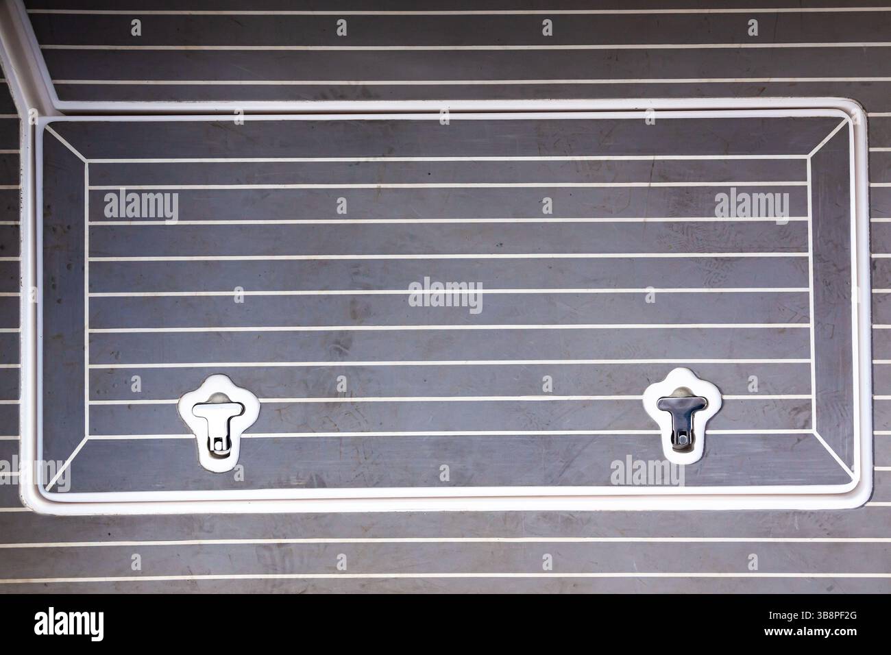 Part of the hull of a sailing yacht with a spare hatch to the yachts ...