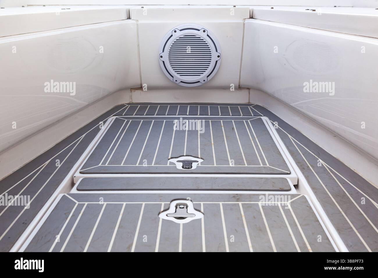 Part of the yacht's teak deck with closed escape hatches to the yacht's cabins and acoustic ...