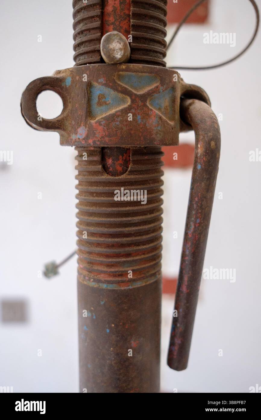 Close-up of a rusty, threaded metal jack. Used for lifting heavy ...