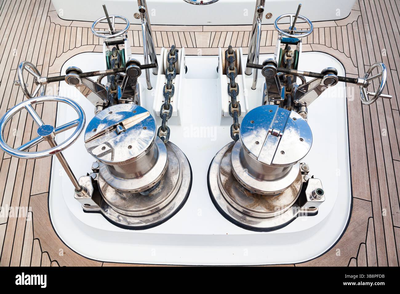 Bow part of the yacht with anchor stops, part of the anchor chain and ...