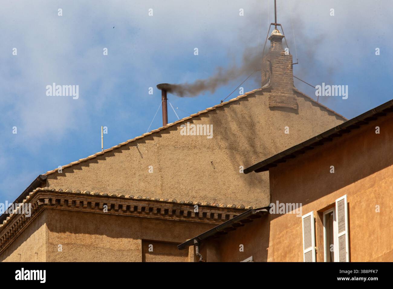 VATICAN CITY – 8 May 2025: Black smoke rises from the chimney of the ...