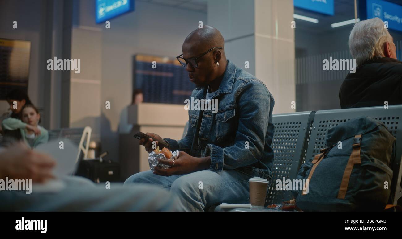 Crowded International Airport Terminal: African American Man Eating ...