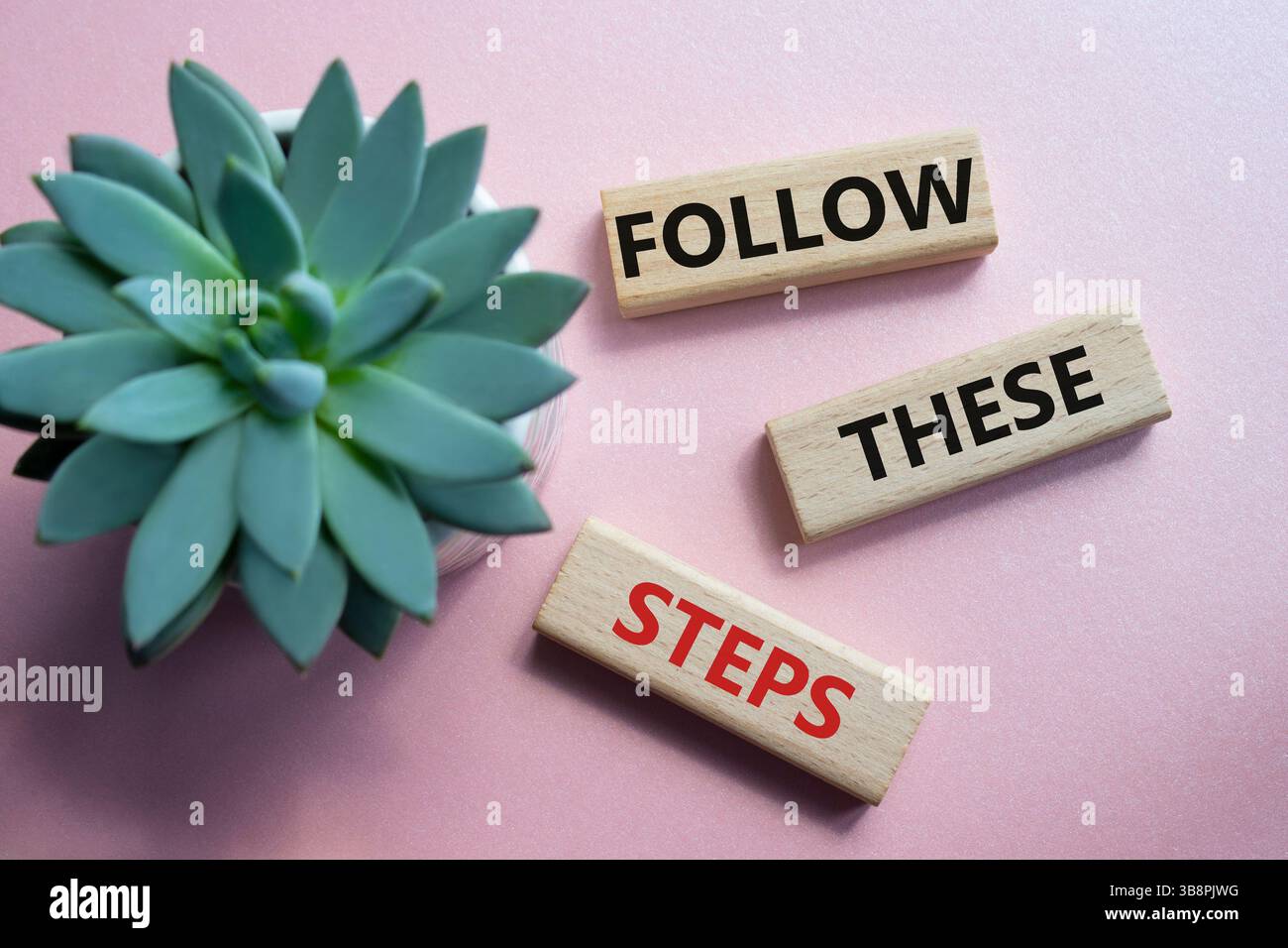 Follow these steps symbol. Wooden blocks with words Follow these steps ...