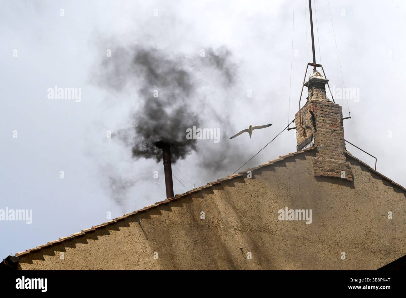 Vatican City, Italy. 08th May, 2025. Black smoke rising from the ...