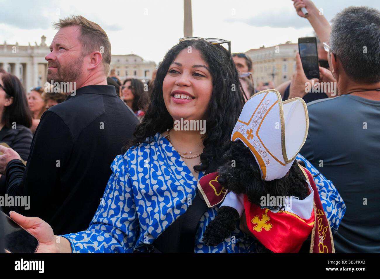 VATICAN POPE VOTE CONCLAVE A woman poses with her dog Romeo dressed as ...