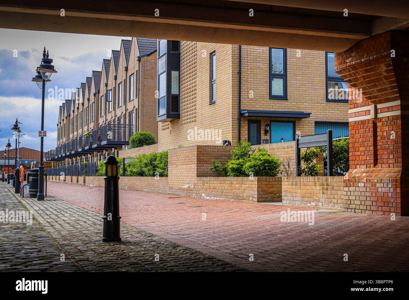 Modern waterside housing overlooking former industrial quayside on the River Medway at St Mary’s ...