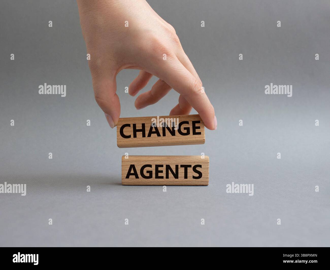 Change agents symbol. Concept word Change agents on wooden blocks ...