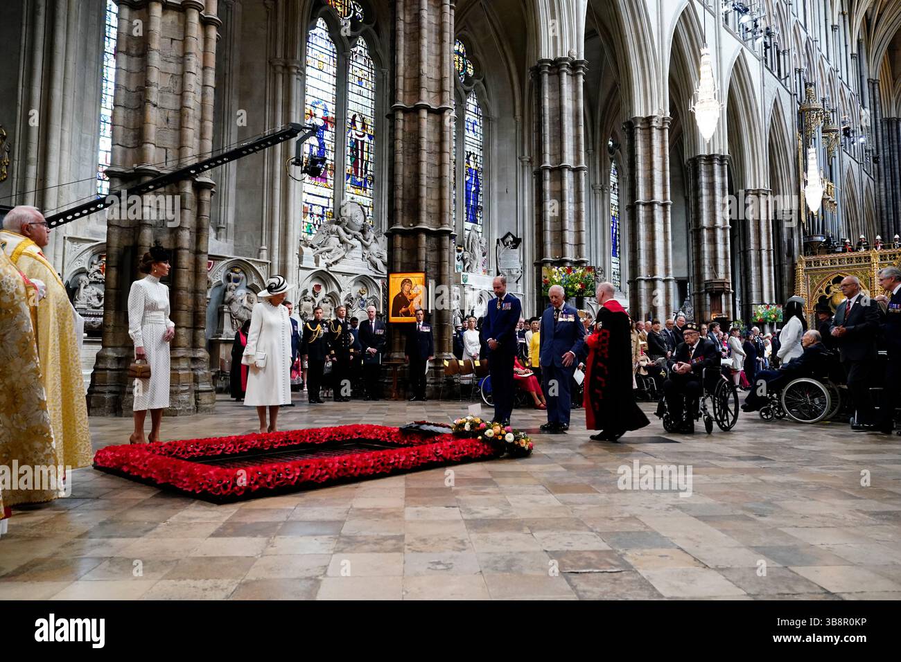 King Charles III and the Prince of Wales are watched by the Princess of ...