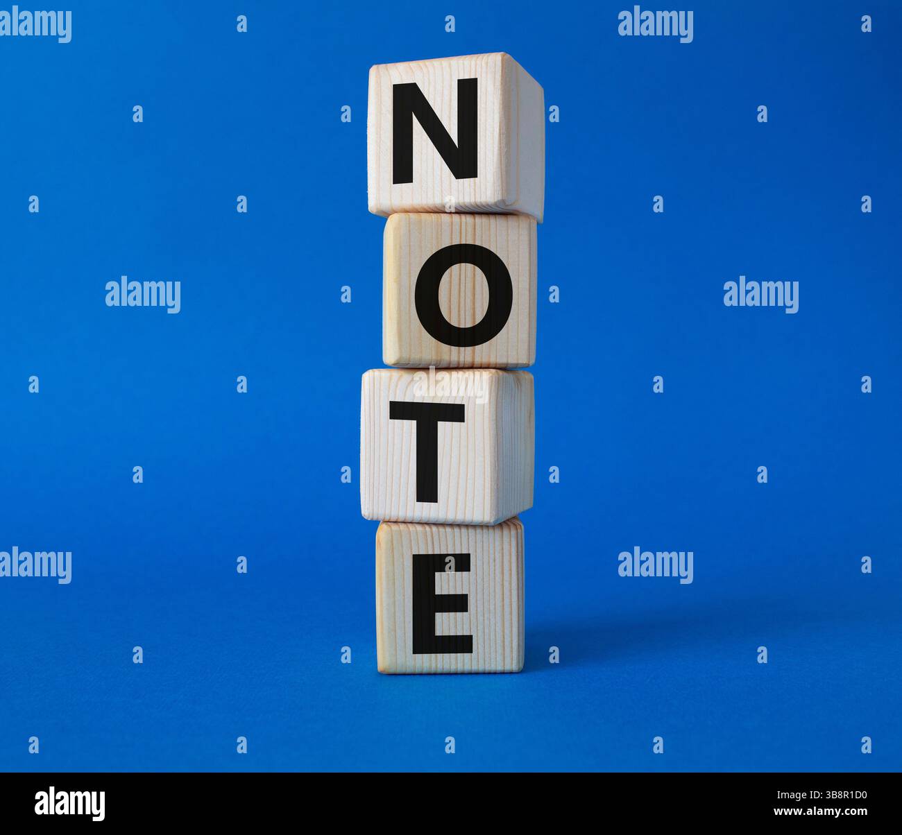 Note symbol. Concept word Note on wooden cubes. Beautiful blue ...