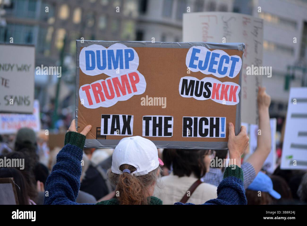 Anti-Trump and Musk signs at a May Day event in Lower Manhattan Stock ...