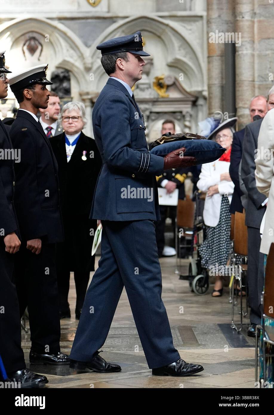 A RAF flying helmet and a Distinguished Flying Cross medal is carried ...