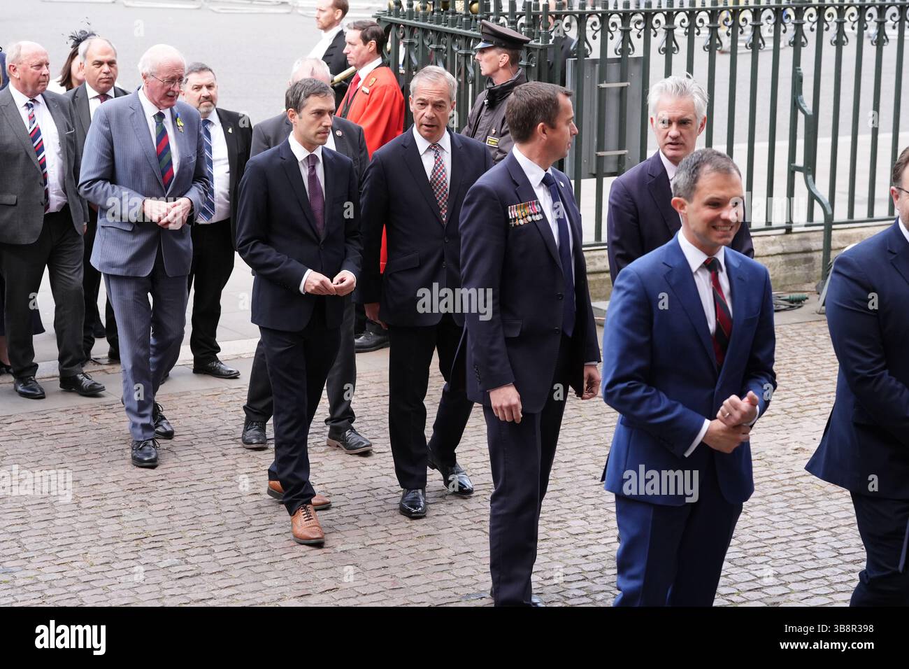 Reform UK leader Nigel Farage (centre) arrives to attend a Service of ...