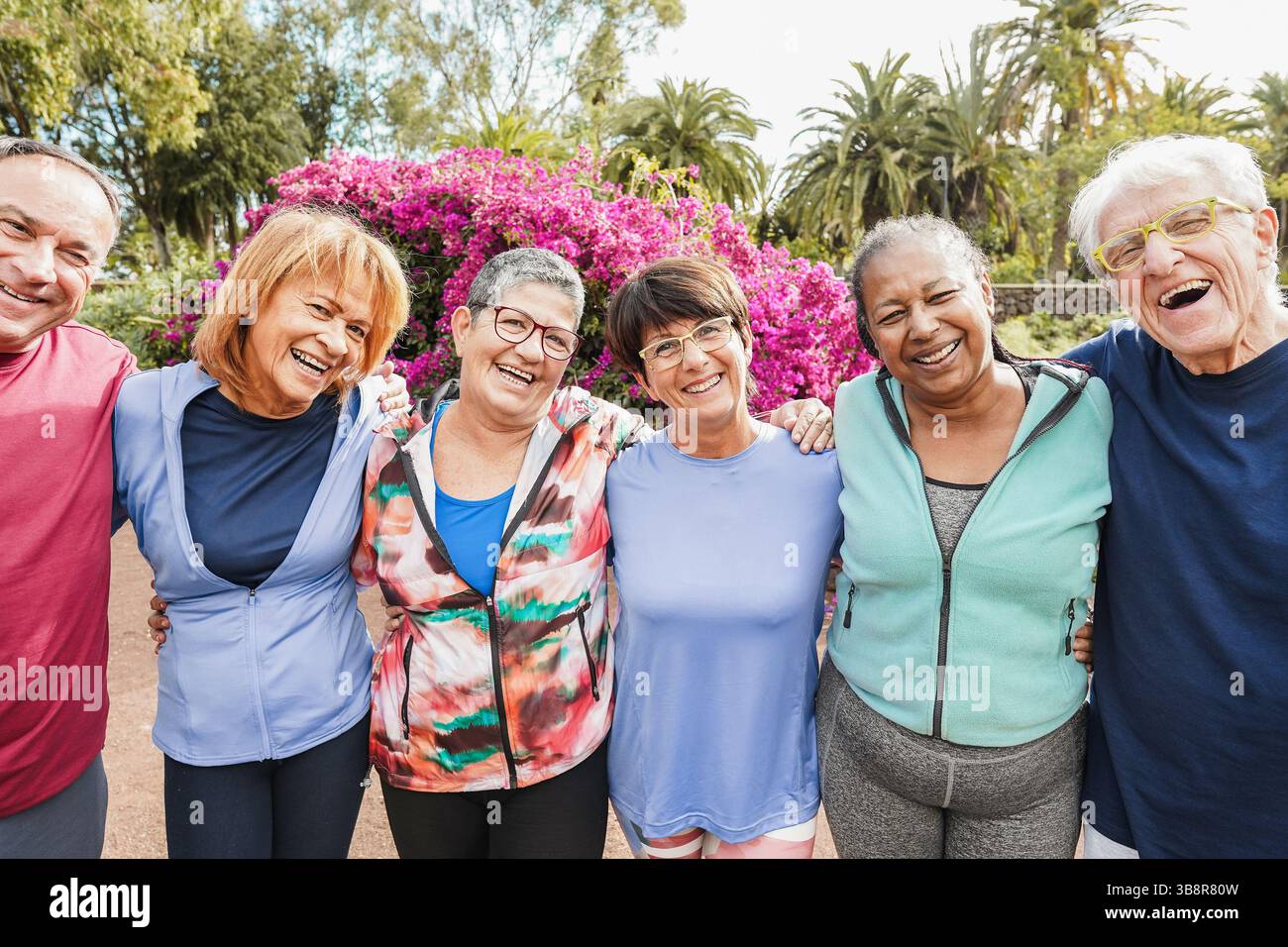 Multiracial senior people having fun after workout exercises outdoor ...