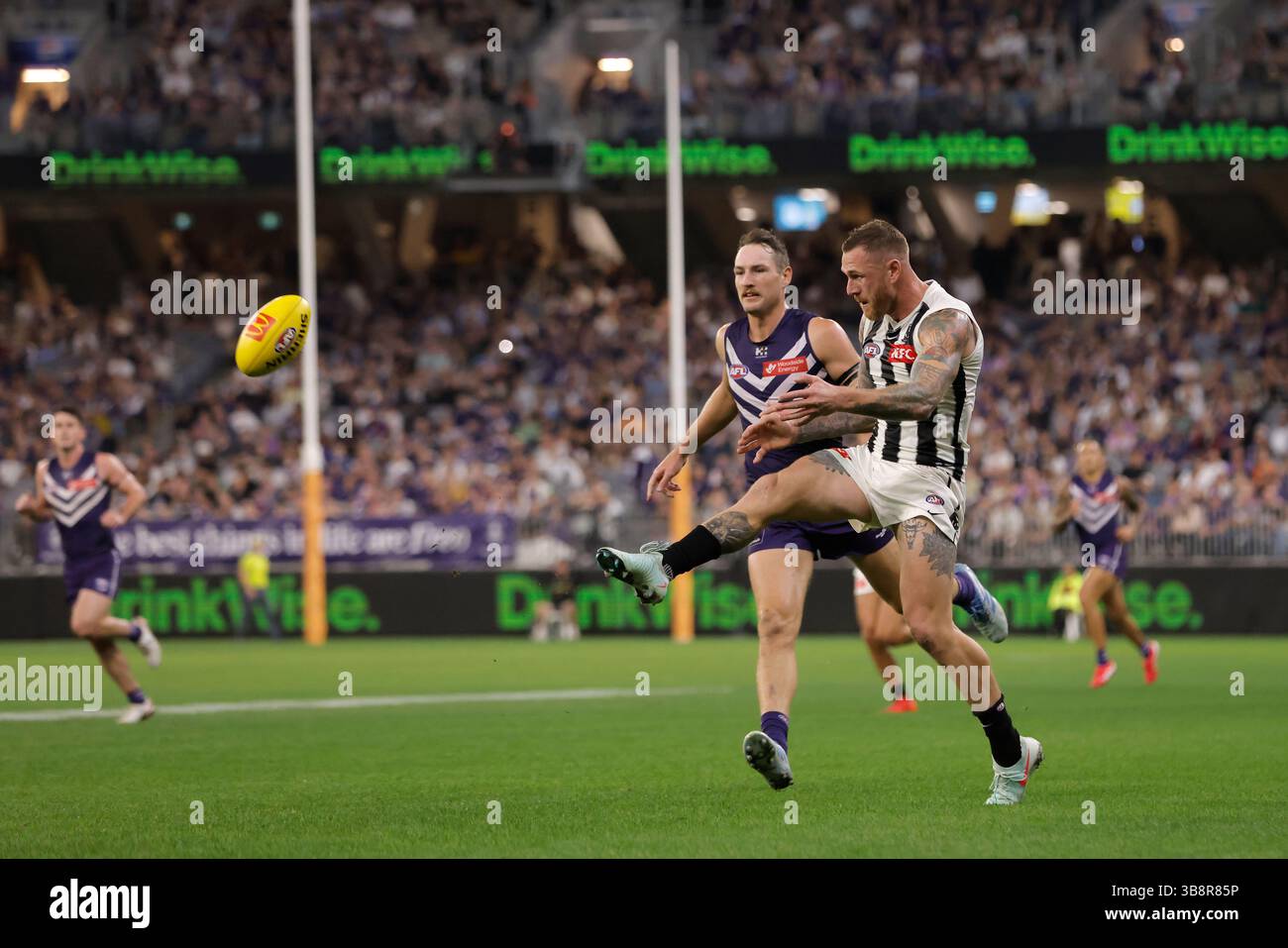 Perth, Australia. 08th May, 2025. Tim Membrey of the Magpies kicks the ...