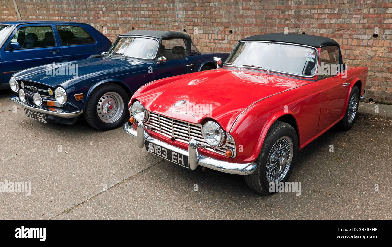 Two triumph Roadsters, a Red, 1964, TR4 and a 1973, Blue TR5, on ...